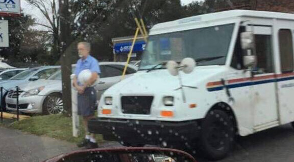 This Photo Of A Postman Standing In The Rain Is Going Viral For All The ...